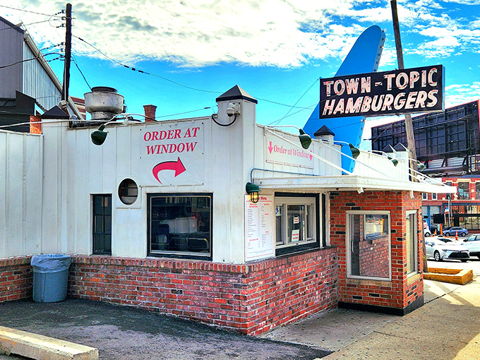 The humble brick-and-white exterior might not scream "culinary destination," but locals know this unassuming building houses burger perfection worth crossing county lines for.