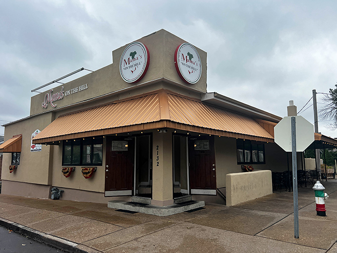 The iconic orange-hued exterior of Mama's On The Hill stands proudly on the corner, a beacon of Italian culinary tradition in St. Louis's historic neighborhood.