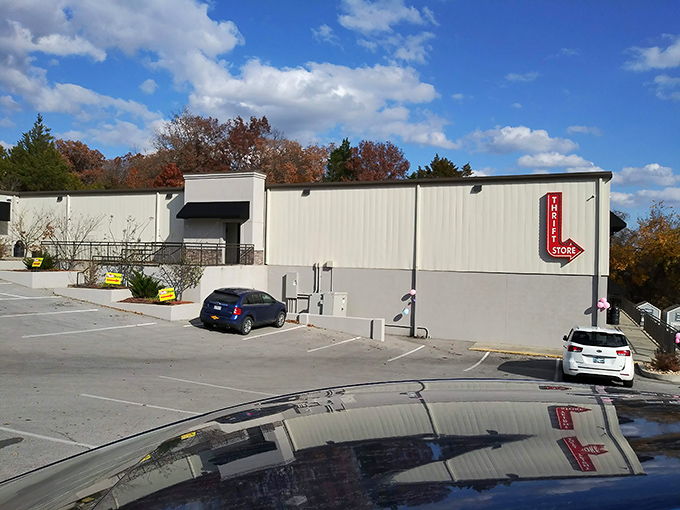 The unassuming exterior of Elevate Thrift Store stands like a treasure chest waiting to be opened, promising bargain-hunting adventures under beautiful Ozark skies.