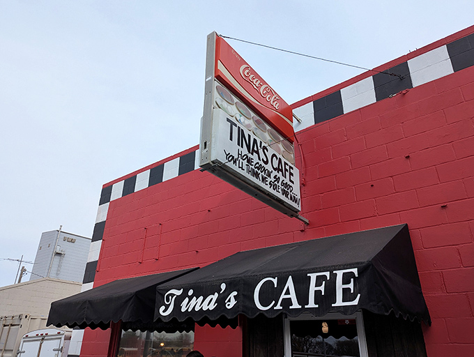 The bright red building with checkered trim stands out like a roadside landmark, inviting travelers in for comfort food that&rsquo;ll leave their taste buds cheering for more.