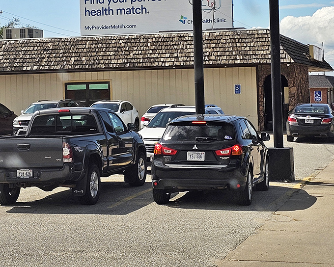 The unassuming exterior of Hi-Way Diner hides culinary treasures within. That packed parking lot tells you everything you need to know about what locals already understand.