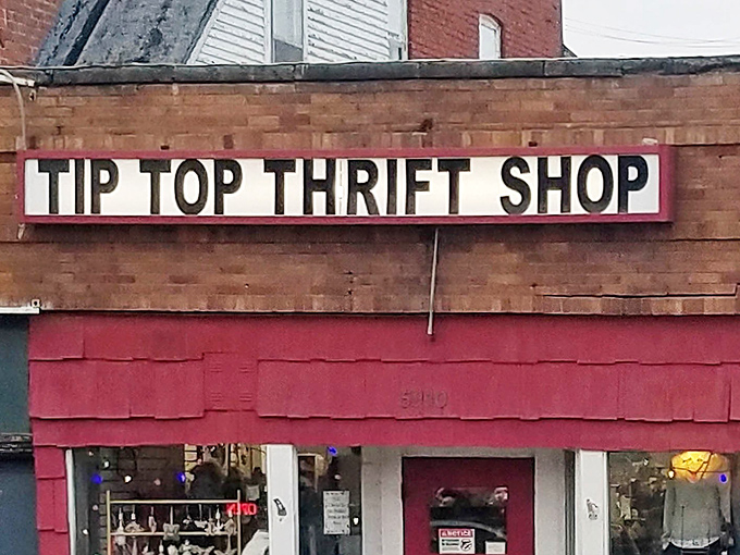 The iconic red facade and bold signage of Tip Top Thrift Shop stands as a beacon to treasure hunters throughout Omaha, promising adventures in secondhand paradise.