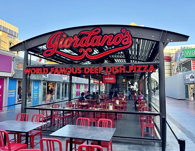 The glowing red Giordano's sign beckons like a pizza lighthouse amid the neon chaos of the Strip. Chicago has landed in Vegas, and it brought its appetite.