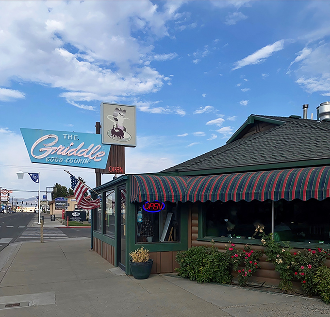 The iconic blue sign beckons hungry travelers like a breakfast lighthouse on Winnemucca's horizon. Good cookin' indeed!