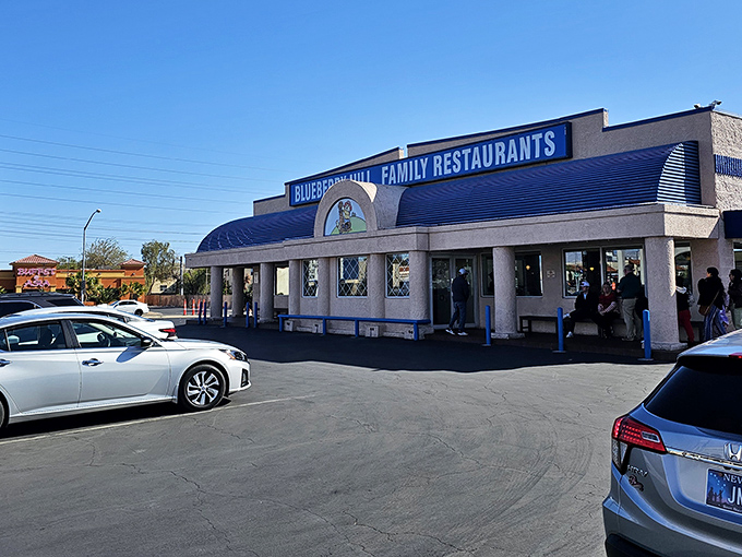 The iconic blue-trimmed exterior of Blueberry Hill stands as a beacon of breakfast hope in a city that never sleeps but always hungers.