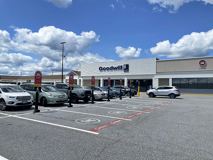 The Hooksett Goodwill under clear New Hampshire skies—where treasure hunting begins with a full parking lot and endless possibilities.