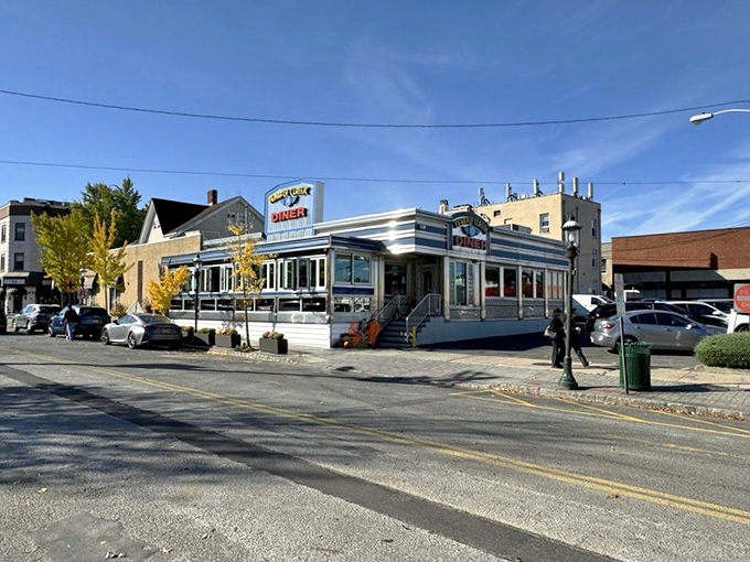 The classic blue-and-chrome exterior of Tenafly Classic Diner glows at dusk, a beacon of comfort food promising that yes, everything is going to be delicious.