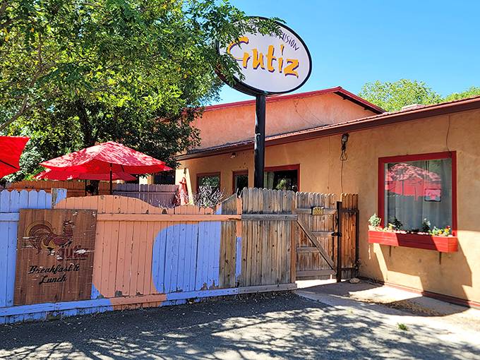 The unassuming salmon-colored adobe exterior of Gutiz hides culinary treasures like a pi&ntilde;ata conceals candy. Those red umbrellas promise shade for sun-drenched diners.