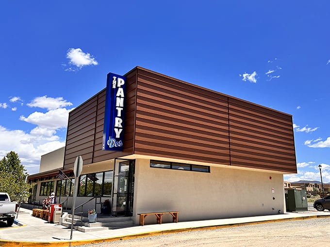 The Pantry Dos stands proudly against Santa Fe's brilliant blue sky, its distinctive blue sign beckoning hungry travelers like a breakfast lighthouse in a sea of hunger.
