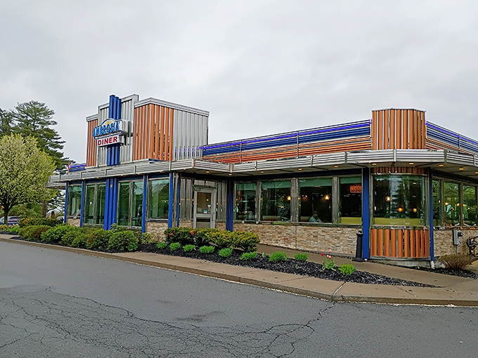 From another angle, Ambrosia's distinctive blue and orange exterior beckons hungry travelers like a retro lighthouse guiding ships to the safe harbor of pancakes.