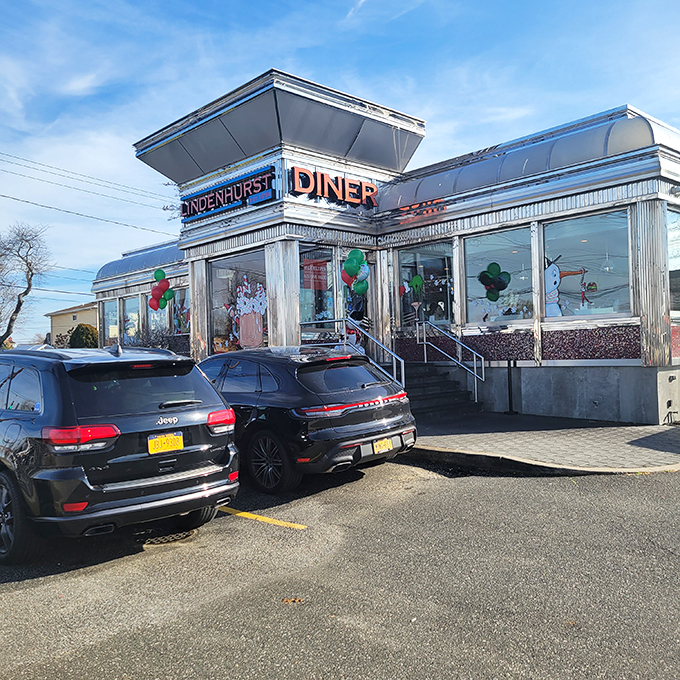 The gleaming stainless steel exterior of Lindenhurst Diner shines like a beacon for hungry travelers, promising comfort food nirvana inside those classic doors.