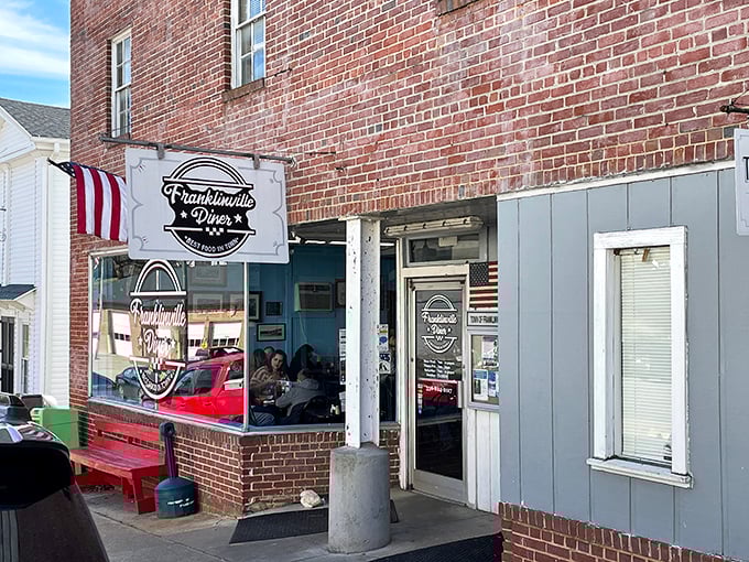 Small-town America in brick and mortar—where the flag flies proudly and the promise of "BEST FOOD IN TOWN" isn't just marketing, it's a mission.