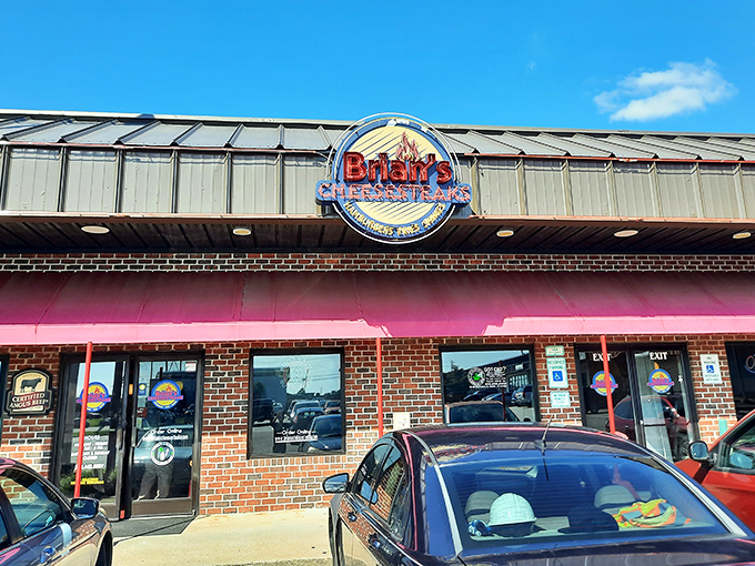 The brick facade and bright signage of Brian's Cheesesteaks stands as a beacon of hope for hungry travelers on Rocky Mount's horizon.