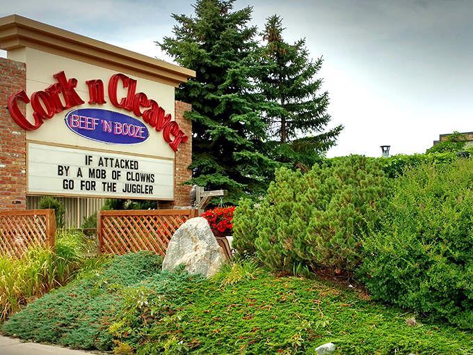 The neon glow of "BEEF 'N BOOZE" isn't just signage&mdash;it's a promise. Cork 'N' Cleaver's exterior beckons carnivores with refreshing honesty about its priorities.