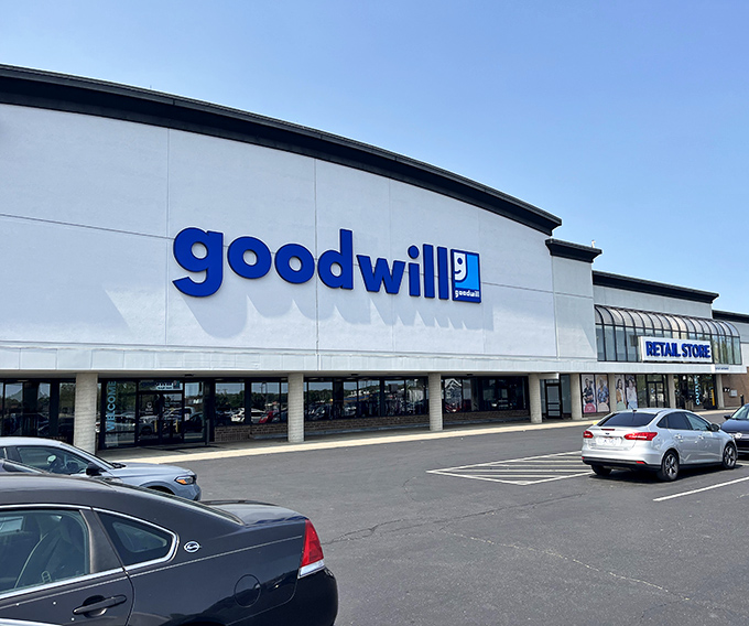 The blue Goodwill sign beckons like a lighthouse for bargain hunters. This Columbus treasure trove promises adventures in thrifting under bright Ohio skies.