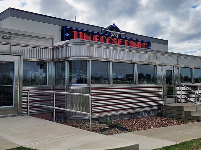 The gleaming silver exterior of Tin Goose Diner shines like a beacon of breakfast hope against the Ohio sky, promising nostalgic flavors and chrome-plated comfort.