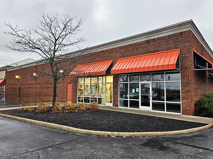 The unassuming brick exterior with bright orange awnings doesn't scream "food paradise," but locals know better. This is where breakfast dreams come true.