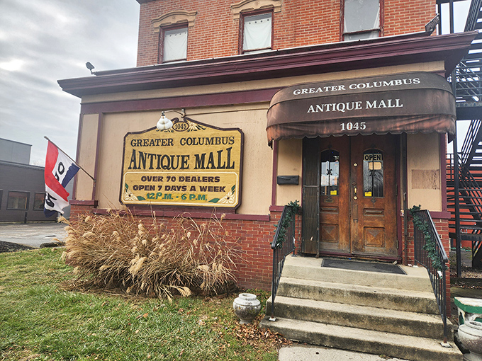 The brick facade of Greater Columbus Antique Mall stands like a time portal on South High Street, promising adventures through decades past.