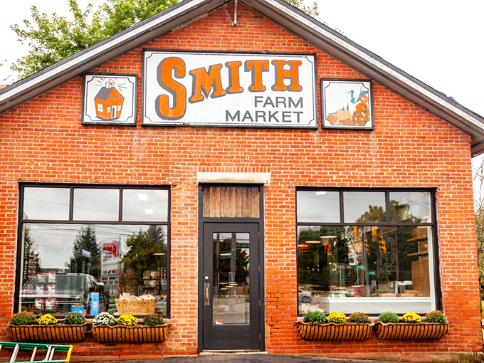 That orange sign might as well say "Happiness Ahead" &ndash; Smith Farm Market's brick fa&ccedil;ade offers a warm welcome to food lovers seeking authentic flavors.