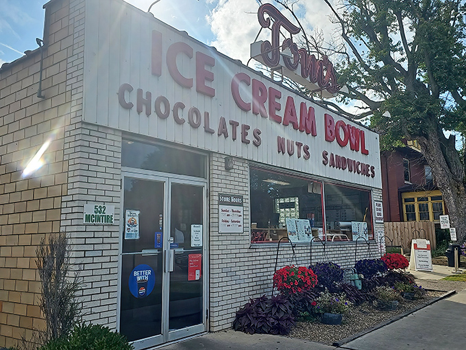 The unassuming white brick fa&ccedil;ade of Tom's Ice Cream Bowl stands as a beacon to ice cream pilgrims. This isn't architecture&mdash;it's a promise of deliciousness inside.