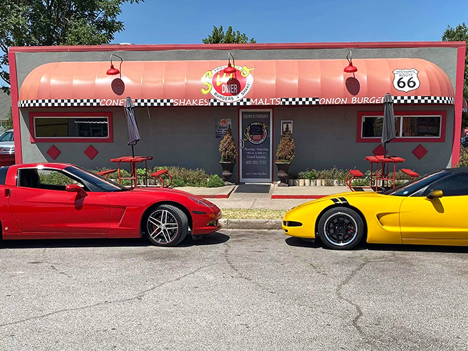Classic cars parked outside Sid's Diner &ndash; where the vehicles are shiny, but the onion burgers are the real showstoppers.