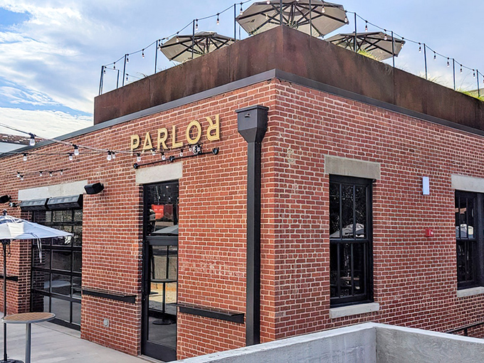 Parlor OKC's brick facade with rooftop seating says "I'm cool without trying too hard" &ndash; industrial chic meets Oklahoma hospitality.