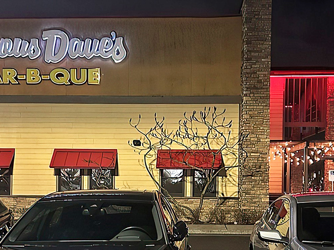 The iconic yellow exterior with red accents of Famous Dave's beckons like a barbecue lighthouse guiding hungry souls to smoky salvation.