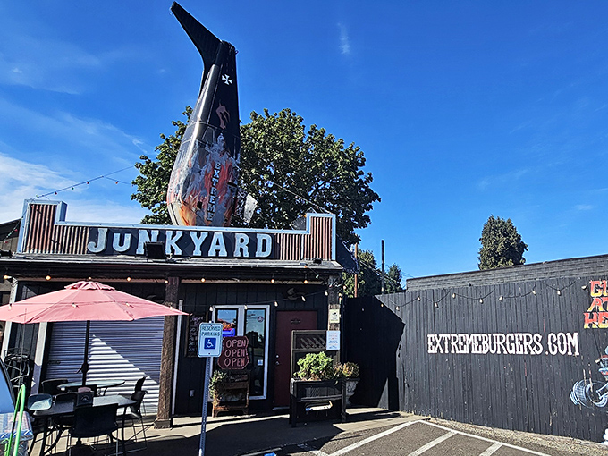 The ultimate roadside attraction &ndash; Junkyard's exterior proudly announces its mission with an actual airplane tail as architectural punctuation.