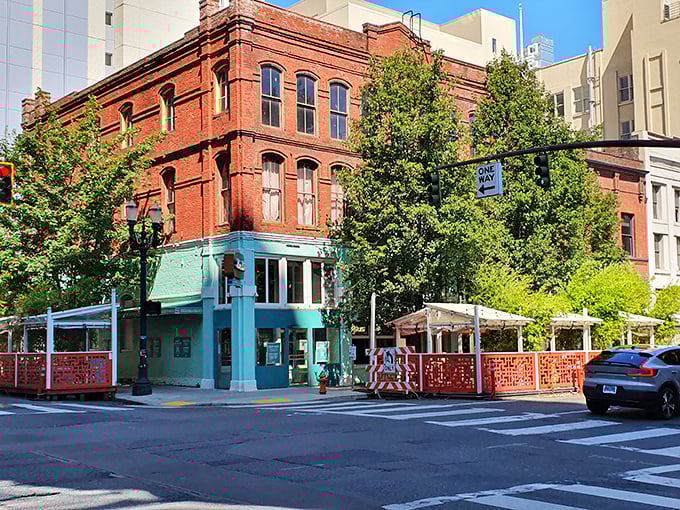 The turquoise corner entrance of Luc Lac stands out like a culinary beacon against classic Portland brick, promising Vietnamese delights within.
