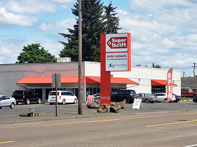 The iconic red SuperThrift sign stands like a beacon for bargain hunters, promising treasures within those unassuming walls.