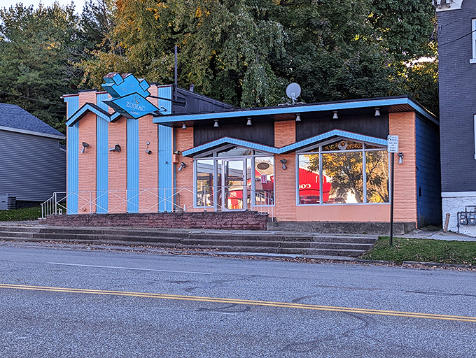 A mid-century modern dream in brick and blue, Zodiac Dinor's exterior promises cosmic comfort food that transcends ordinary breakfast expectations.