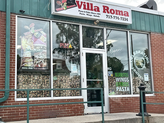 The unassuming storefront of Villa Roma might not stop traffic, but locals know this humble facade hides pizza treasures worth their weight in gold.