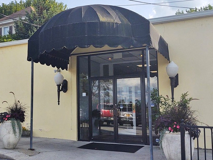 The unassuming cream exterior with its elegant black awning is like a secret handshake &ndash; those who know, know. This isn't flashy; it's focused on what matters inside.