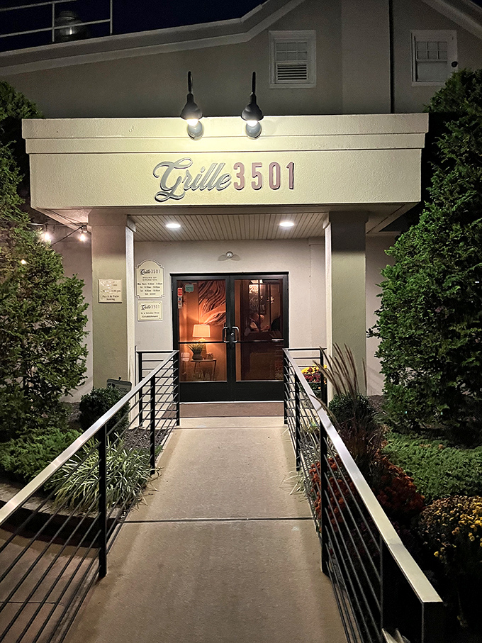 The unassuming entrance to Grille 3501 proves that culinary greatness doesn't need flashy neon. Like a speakeasy for spectacular food.