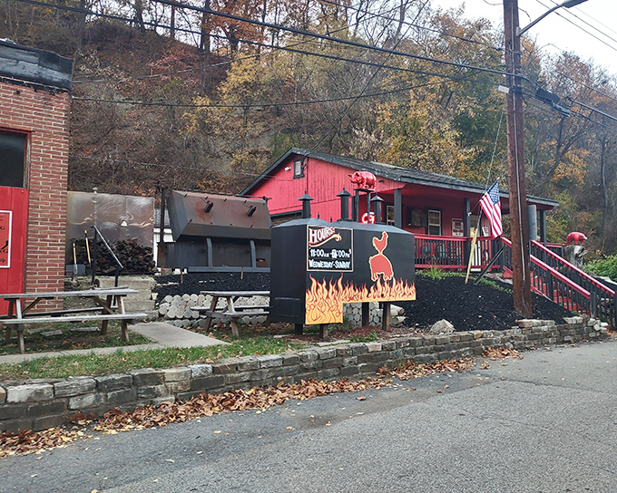 Where there's smoke, there's barbecue magic. The outdoor smoker and woodpile aren't just equipment&mdash;they're the beating heart of Pittsburgh BBQ's operation.