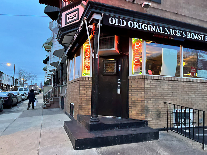 The corner beacon of beefy bliss! Nick's modest brick exterior with neon signs promises more flavor than flash&mdash;Philadelphia's culinary truth in advertising.