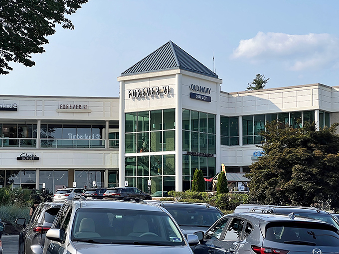 The clean white facades of Pocono Premium Outlets blend seamlessly with the mountain backdrop, like a retail oasis waiting to be discovered.