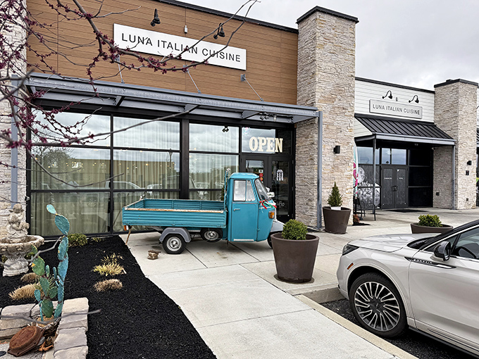 The stone facade and vintage Italian three-wheeler create a perfect first impression &ndash; like being greeted by a Vespa-riding nonna saying "Mangia!"
