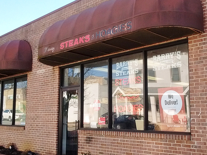 Another angle reveals Barry's unpretentious charm, where "We Deliver!" means happiness arrives at your door wrapped in paper.