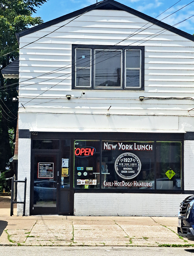 The unassuming white exterior of New York Lunch on East Avenue might not stop traffic, but locals know this modest facade hides culinary treasures within.
