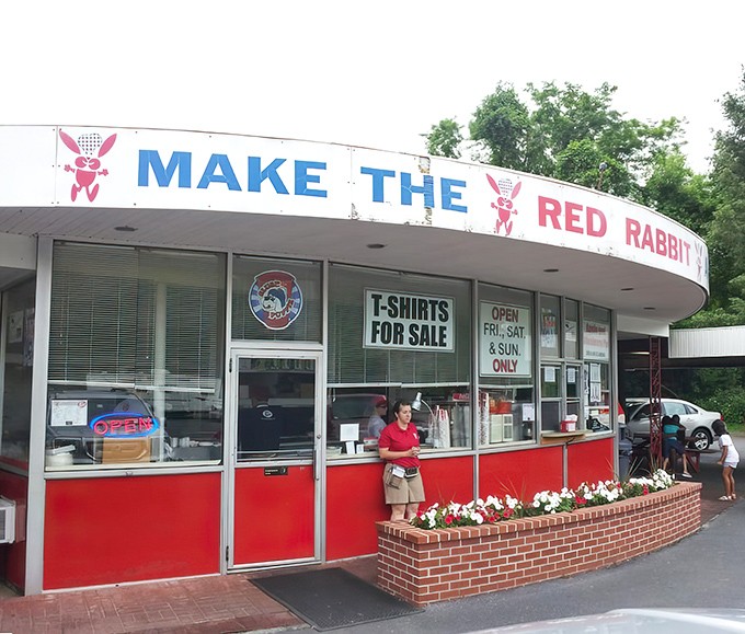 The iconic Red Rabbit sign beckons hungry travelers like a neon lighthouse on the shores of comfort food. Simple, nostalgic, and absolutely perfect.