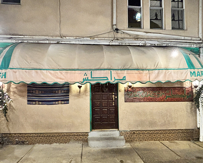 The turquoise and white striped awning of Marrakesh beckons like a mirage in Philadelphia, complete with decorative palm trees that whisper promises of exotic flavors within.