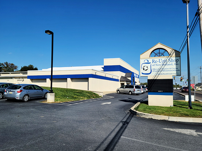 The blue and cream exterior of Re-Uzit Shop stands like a beacon of bargain hope under Pennsylvania's clear skies. Your wallet's new best friend awaits.