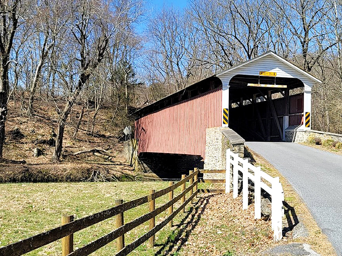 The classic red siding against Pennsylvania's blue sky creates that perfect "I've stepped back in time" moment at Mercer's Mill Covered Bridge.