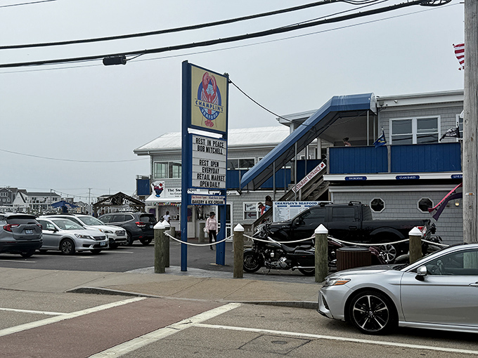 The iconic blue-trimmed exterior of Champlin's stands like a beacon for seafood lovers. That sign might as well say "Happiness Served Daily."