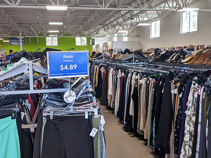The treasure hunt begins! Neatly organized racks stretch across this bright, airy Goodwill where $4.89 pants are just the beginning of your thrifting adventure.