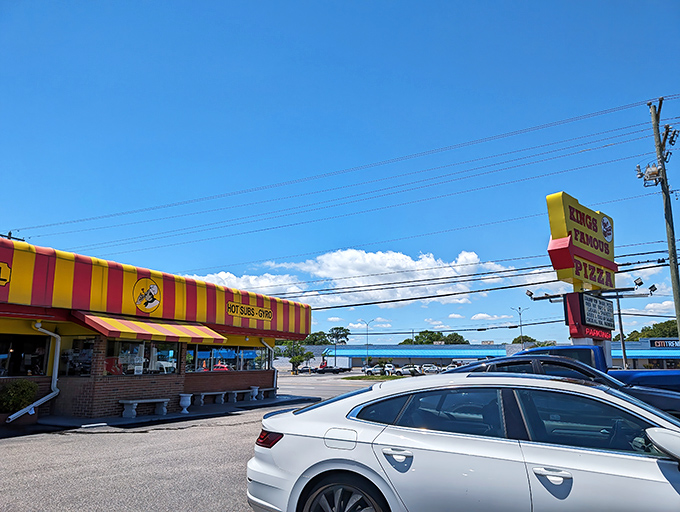 The brick exterior and classic bench seating create that perfect "come as you are" vibe where flip-flops are welcome and pizza perfection awaits inside.