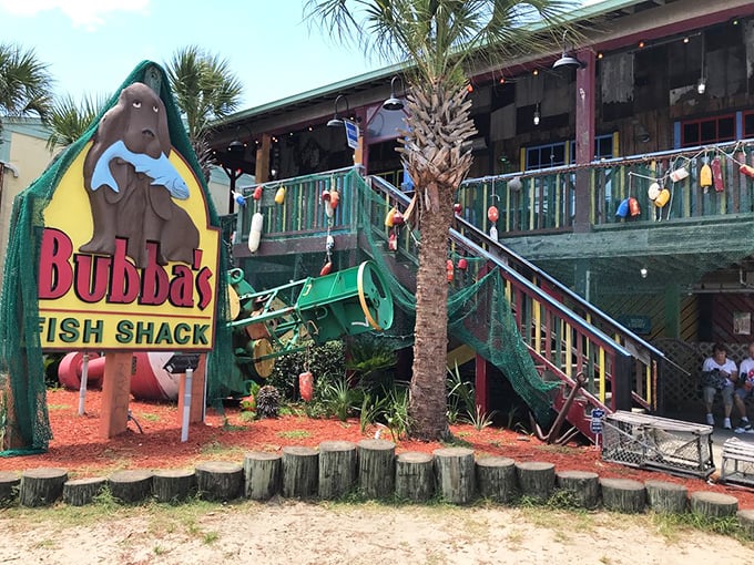 That iconic manatee mascot clutching a fish tells you everything &ndash; this isn't fancy dining, it's seafood paradise wrapped in weathered wood and coastal charm.