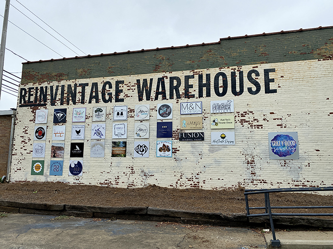 The weathered brick exterior tells stories before you even step inside. Vintage logos and signs hint at the creative community thriving within these walls.