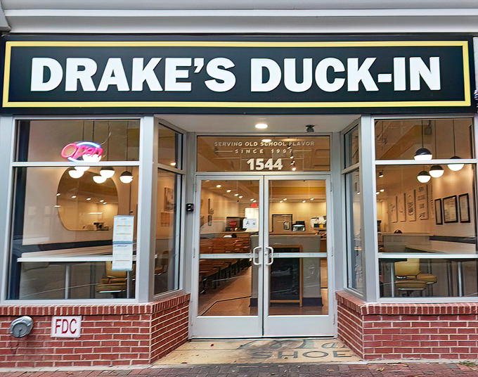 The iconic green and white sign beckons hungry souls to Columbia's Main Street, promising "old school flavor since 1957" – a promise they've kept deliciously well.